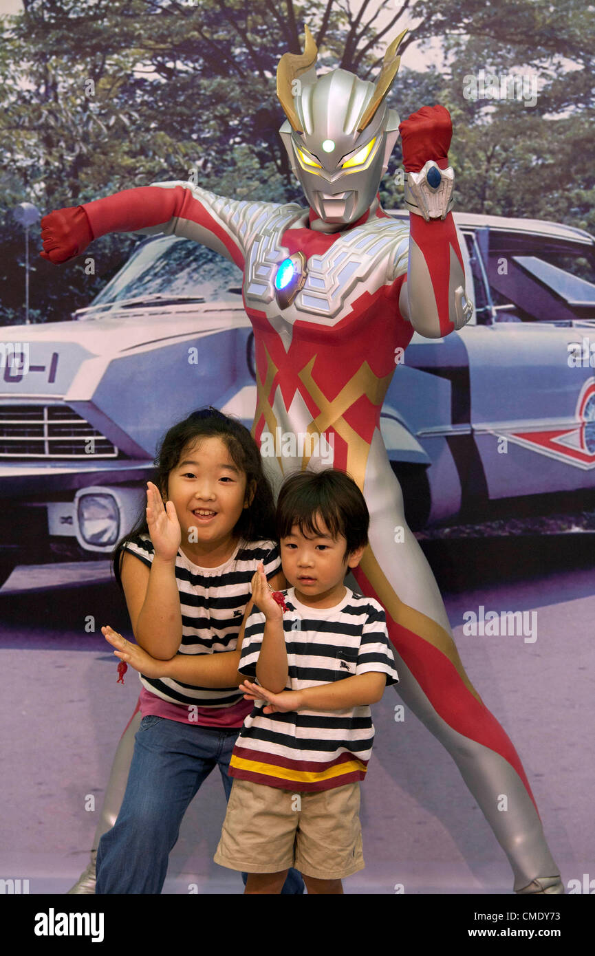 July 27 2012, Tokyo, Japan - Children pose with the Ultraman character ...