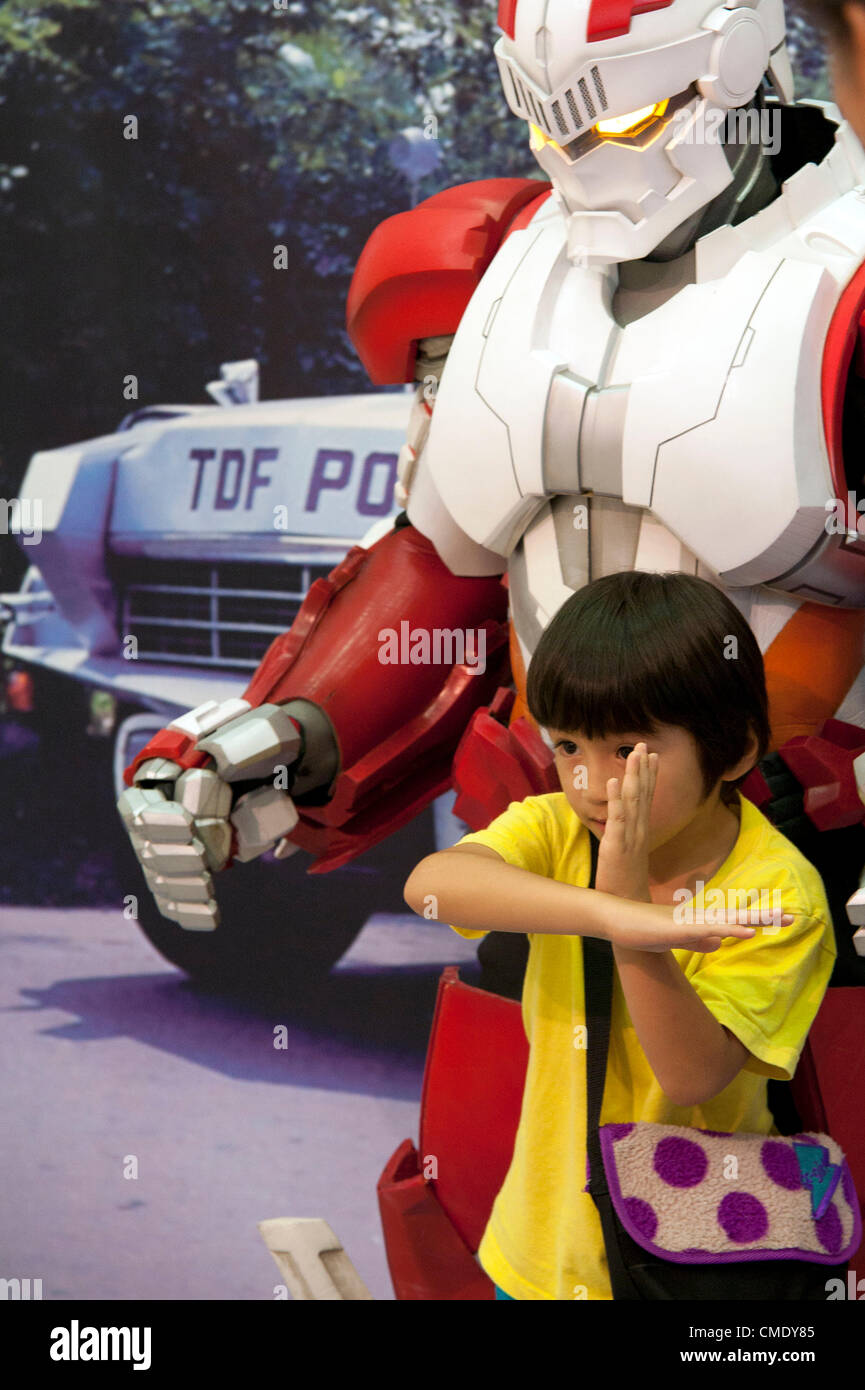 July 27 2012, Tokyo, Japan - A kid poses with Ultraman statue at the ...