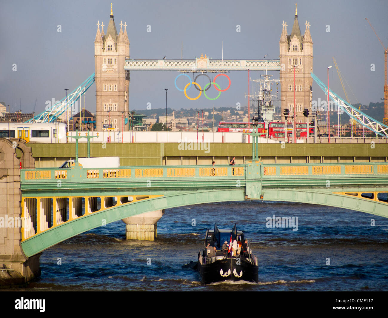 London, UK. 25 July, 2012. Tower Bridge, London, with Olympic Rings 5 ...