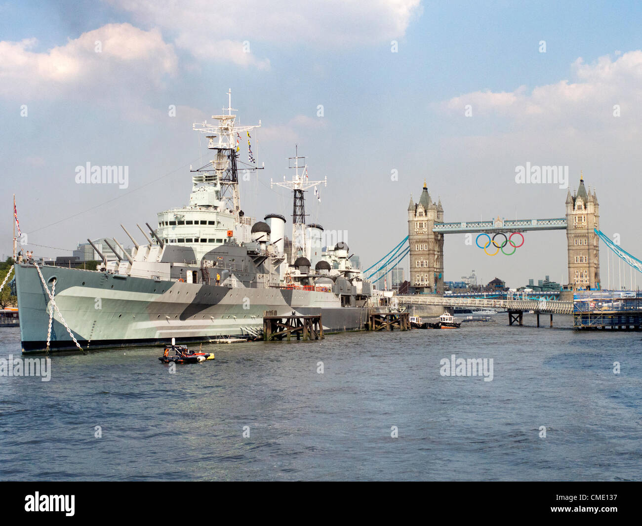 London, UK. 25 July, 2012. HMS Belfast and Tower Bridge, London, with ...