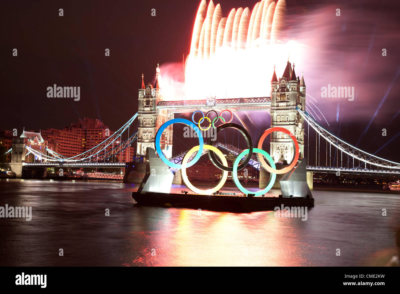 London, UK. Friday 27th July 2012. Olympic flame passes Tower Bridge ...