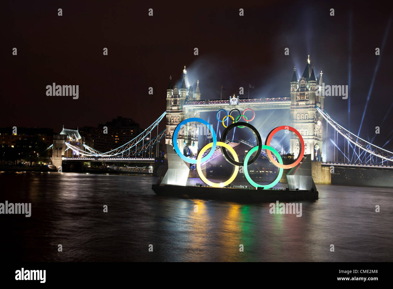 London, UK. Friday 27th July 2012. Olympic flame passes Tower Bridge ...