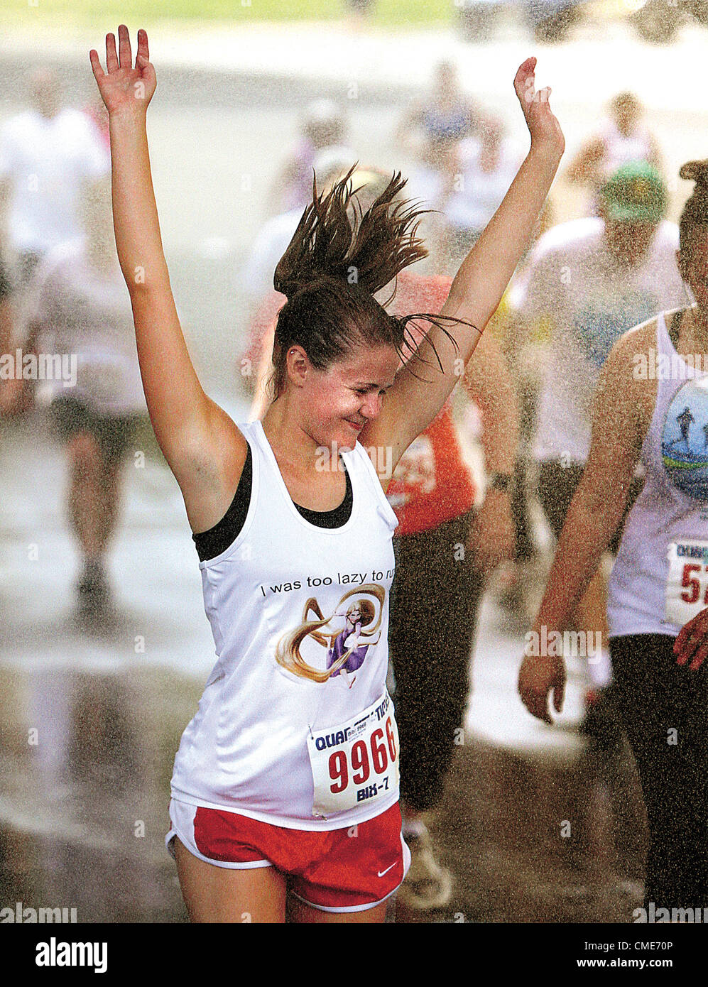 July 28, 2012 - Iowa, U.S. - Maddie Seutter, of Davenport, runs through ...