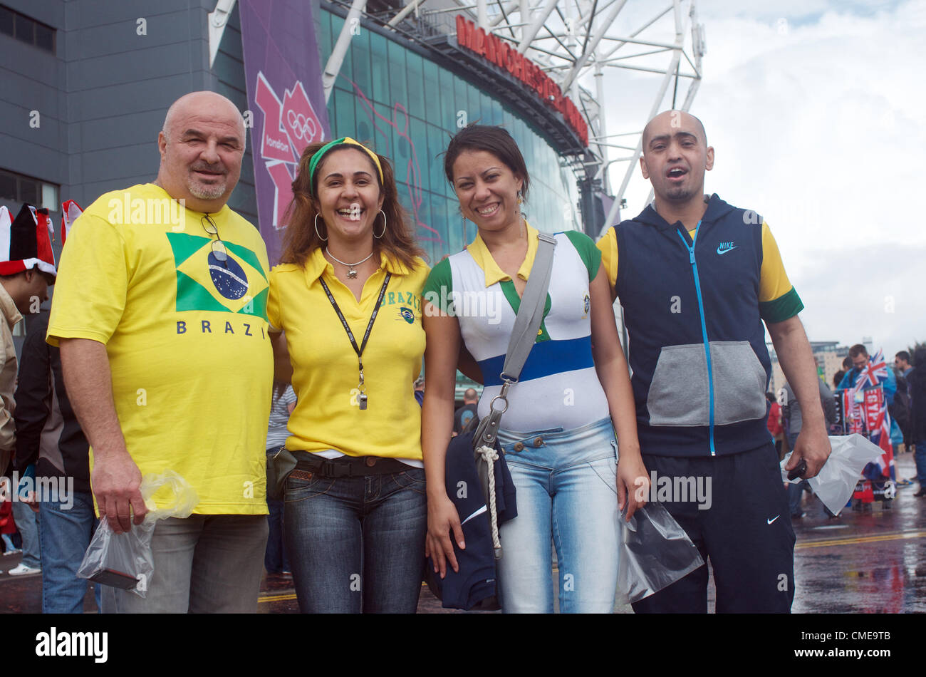Four Brazilian fans pose outside Old Trafford, Manchester United's ...