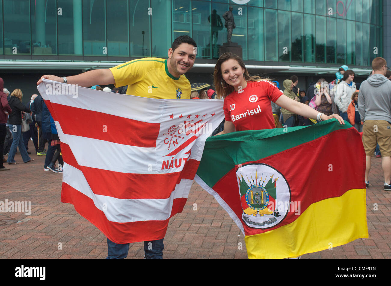 Two Brazilian fans pose outside Old Trafford, Manchester United's ...