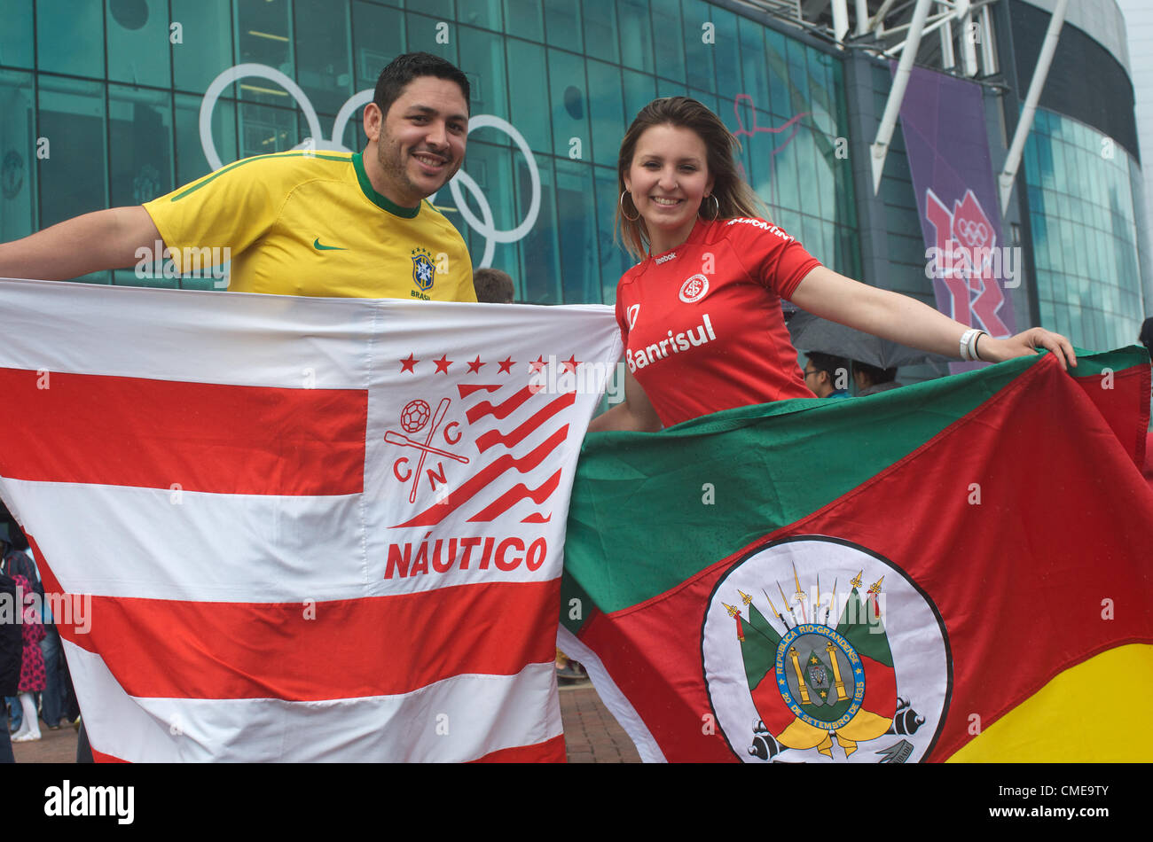 Two Brazilian fans pose outside Old Trafford, Manchester United's ...