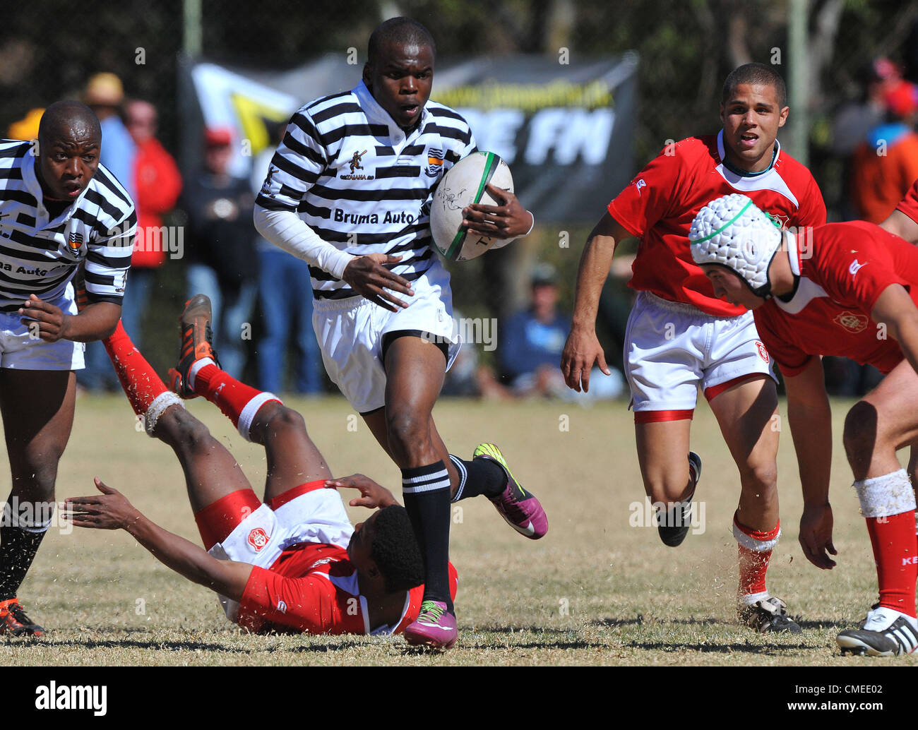JOHANNESBURG, SOUTH AFRICA - JULY 28, Sandile Sibande of Jeppe breaks ...