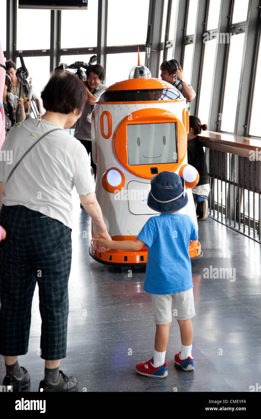 August 01 2012, Tokyo, Japan - Visitors see the new robot guide "Tawabo ...