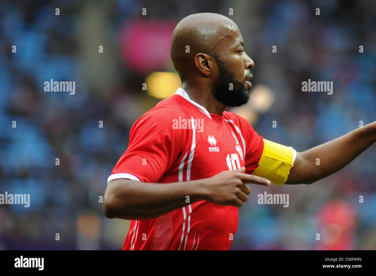 01.08.2012 Coventry, England. RASHED EISA (UAE) crosses the ball for ISMAEIL MATAR (UAE) to ...