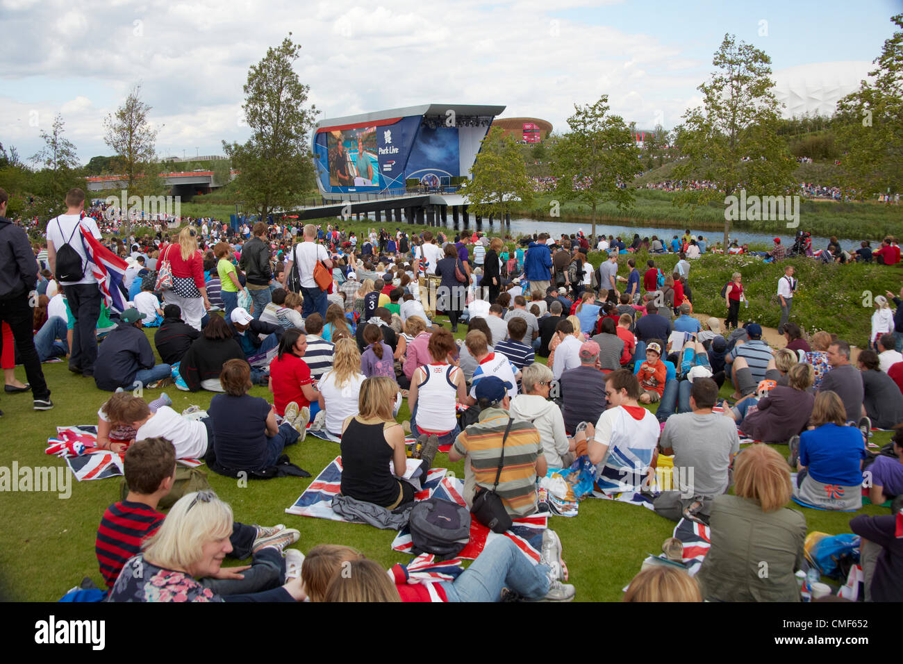 Spectators watching giant outdoor screens at Park View West on a sunny ...
