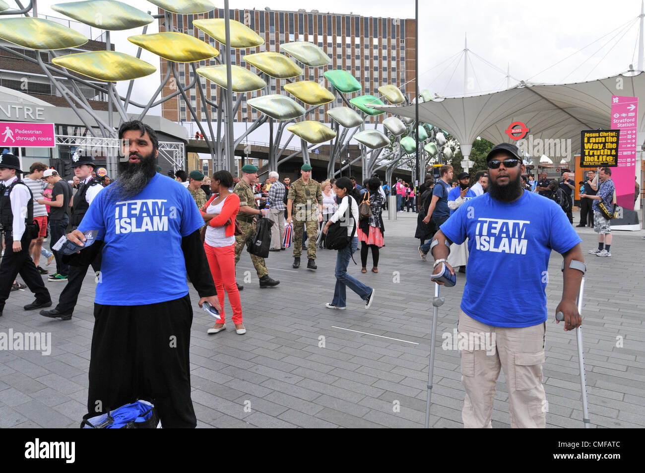 Stratford, London, UK. 2nd August 2012. Members of 'Team Islam' hand ...