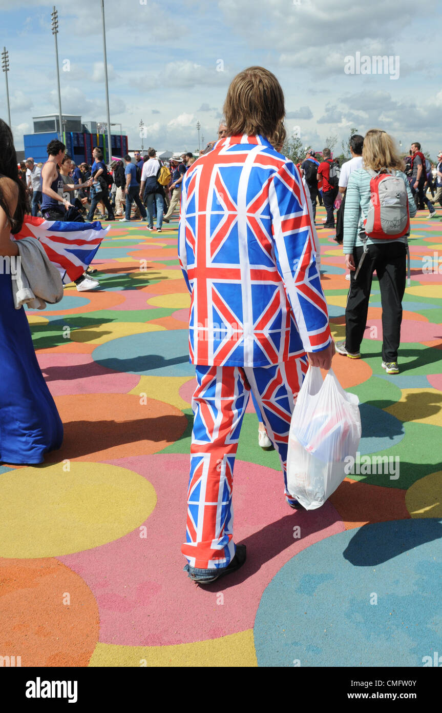 A Team GB supporter wearing a Union Jack suit, walks through the ...