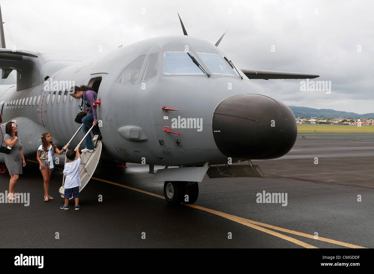 Visitors explore a range of military aircraft and helicopters during ...