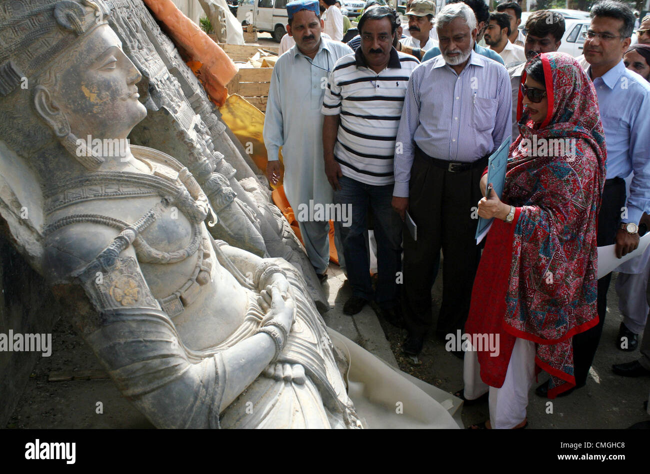 7th Aug 2012. Sindh Culture Minister Sassi Palejo looks the Budha ...