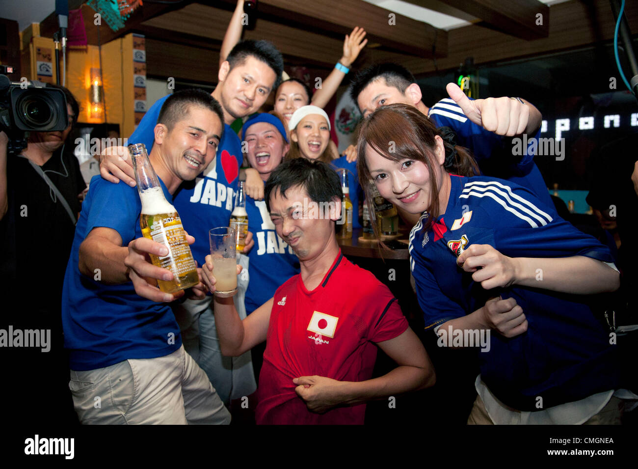 August 07 2012, Tokyo, Japan - Japanese fans celebrate the first goal ...