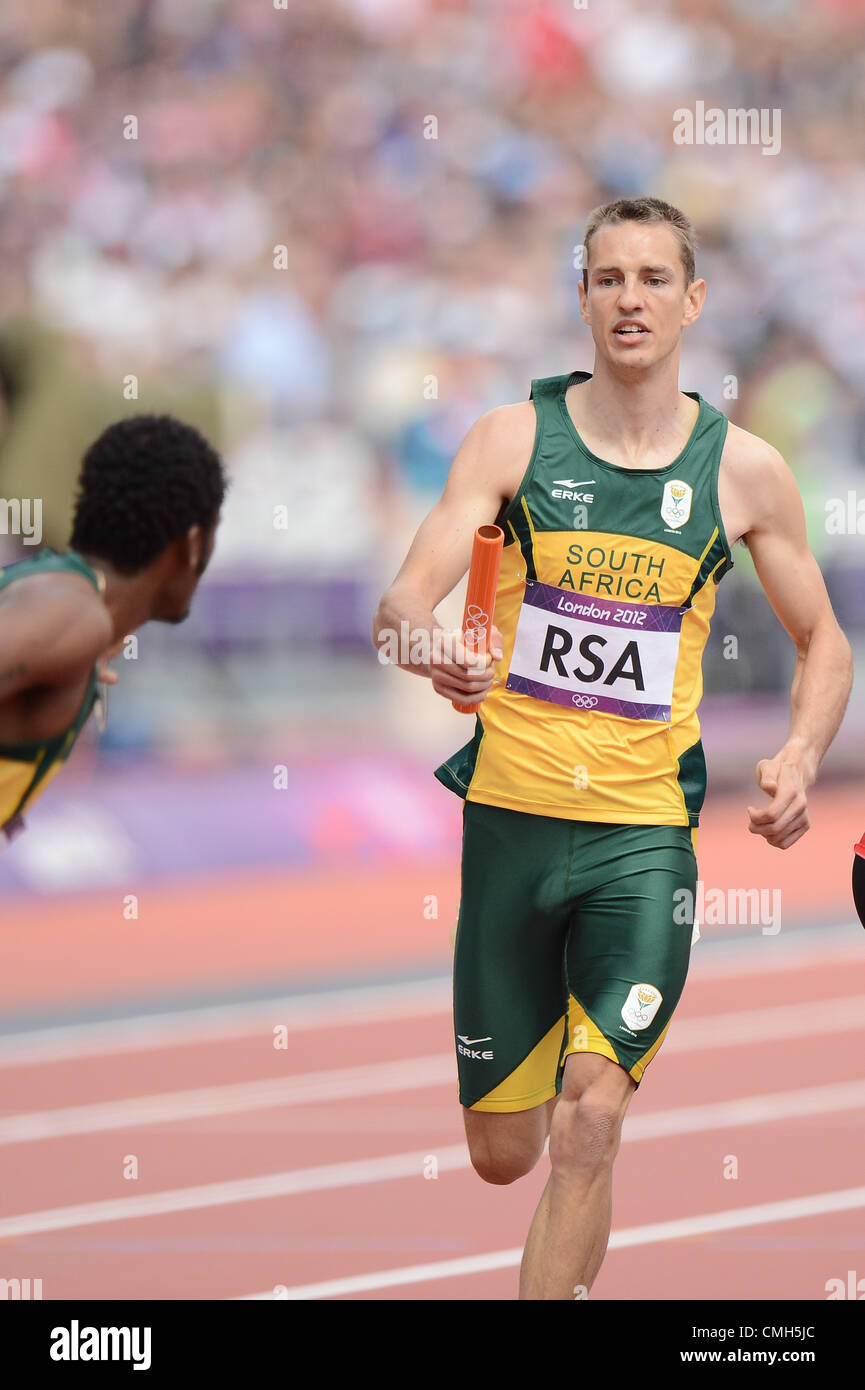 LONDON, ENGLAND - AUGUST 9, Shaun De Jager hands over the baton to ...