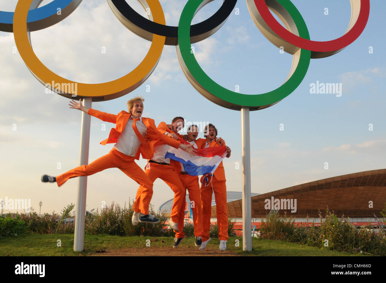 Holland supporters jump for joy in front of the Olympic Rings and the ...