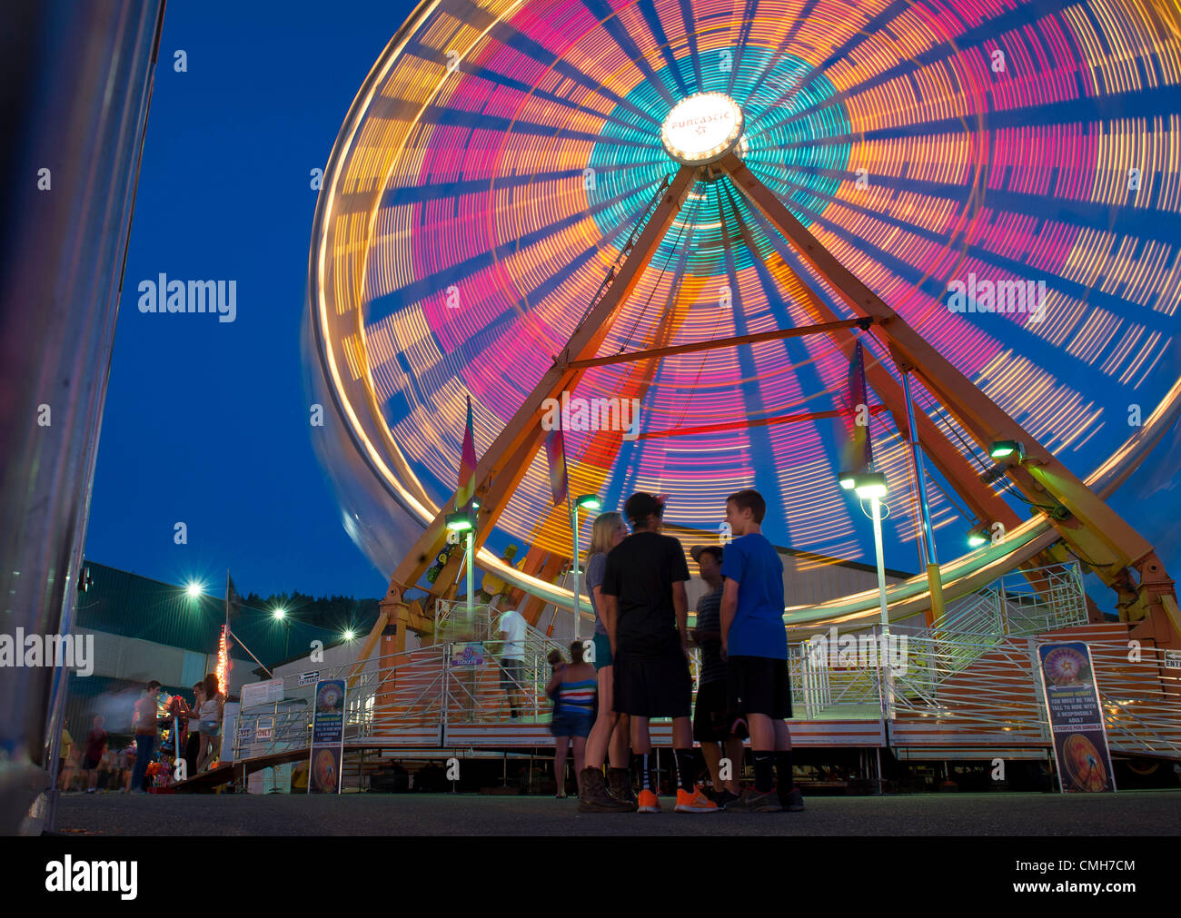 Aug. 9, 2012 - Roseburg, Oregon, U.S - Carnival rides spin on the ...