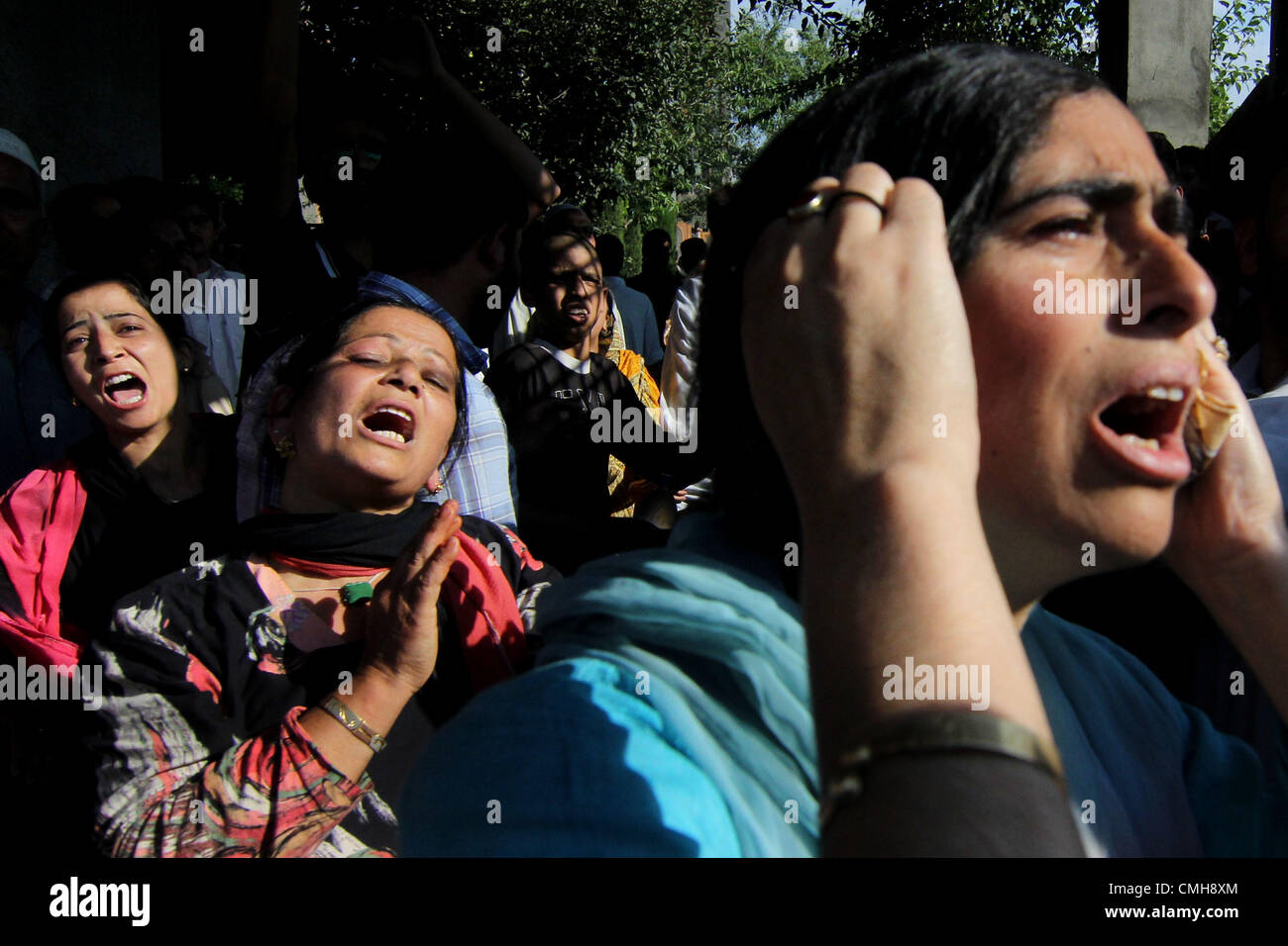Aug. 10, 2012 - Relatives of Abdul Hamid Bhat wail during his funeral procession at Tengpora in ...