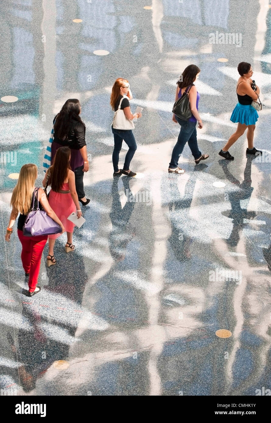 August 11, 2012 - Los Angeles, California, USA - Women walk single file ...