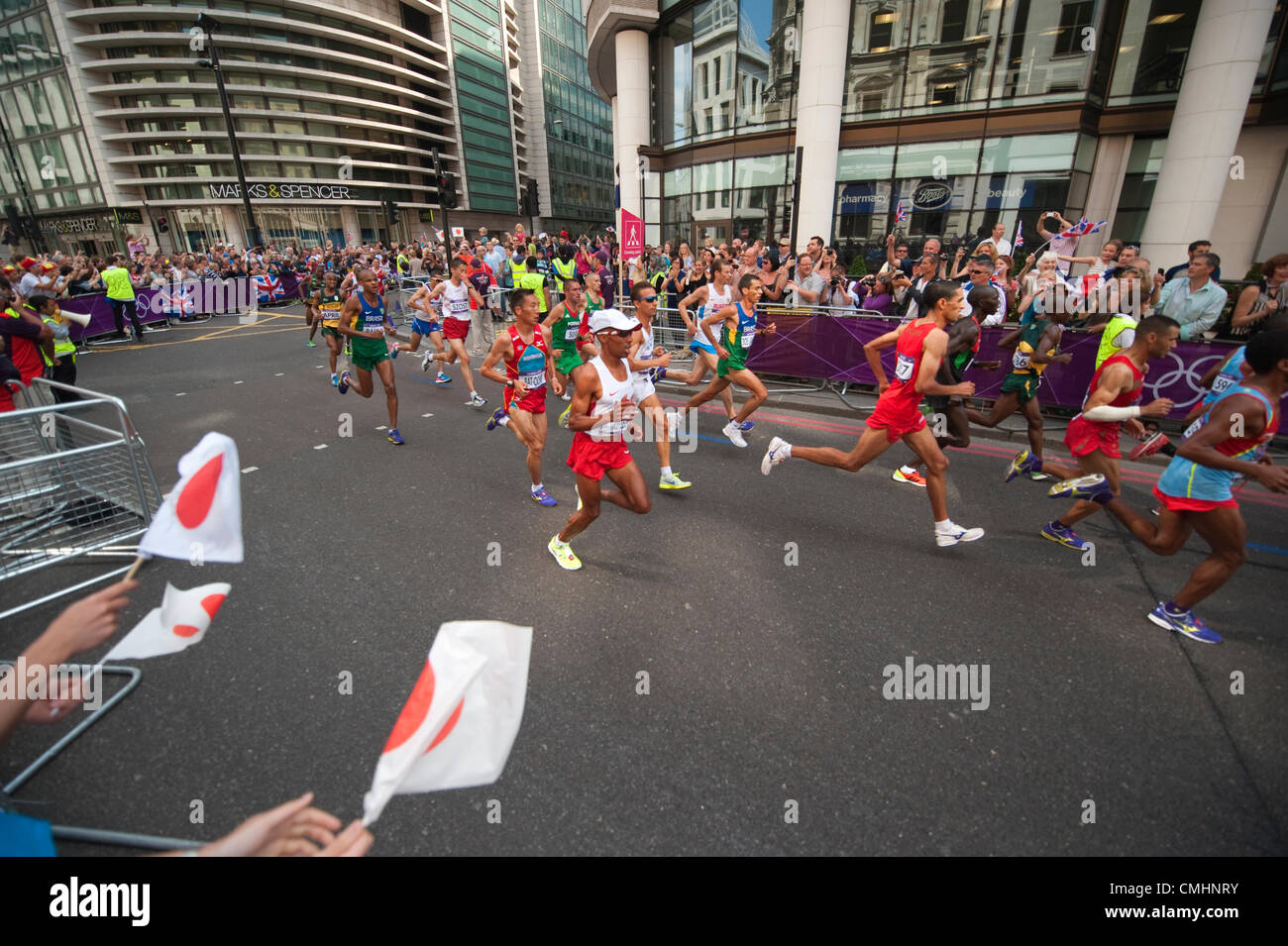 Runners pass thousands of cheering spectators at Gracechurch Street in ...