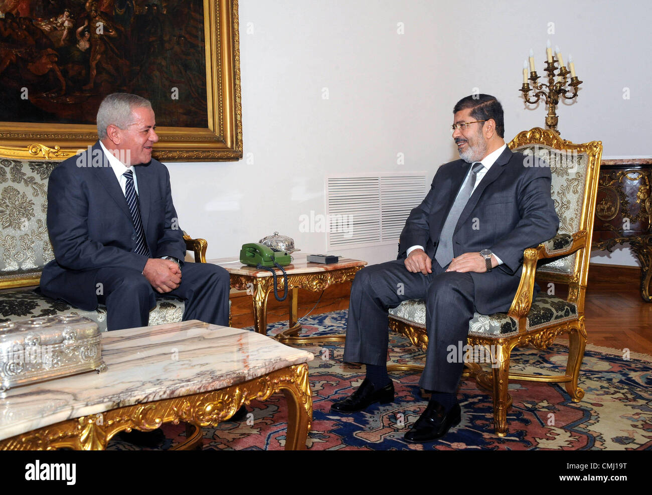 13th Aug 2012. Cairo, Cairo, Egypt - Egypt's President Mohamed Mursi (R ...