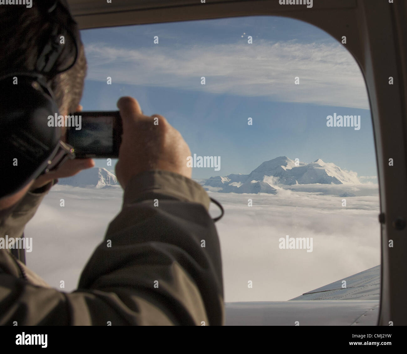 June 26, 2012 - Alaska, US - A tourist on a Denali Air sightseeing ...