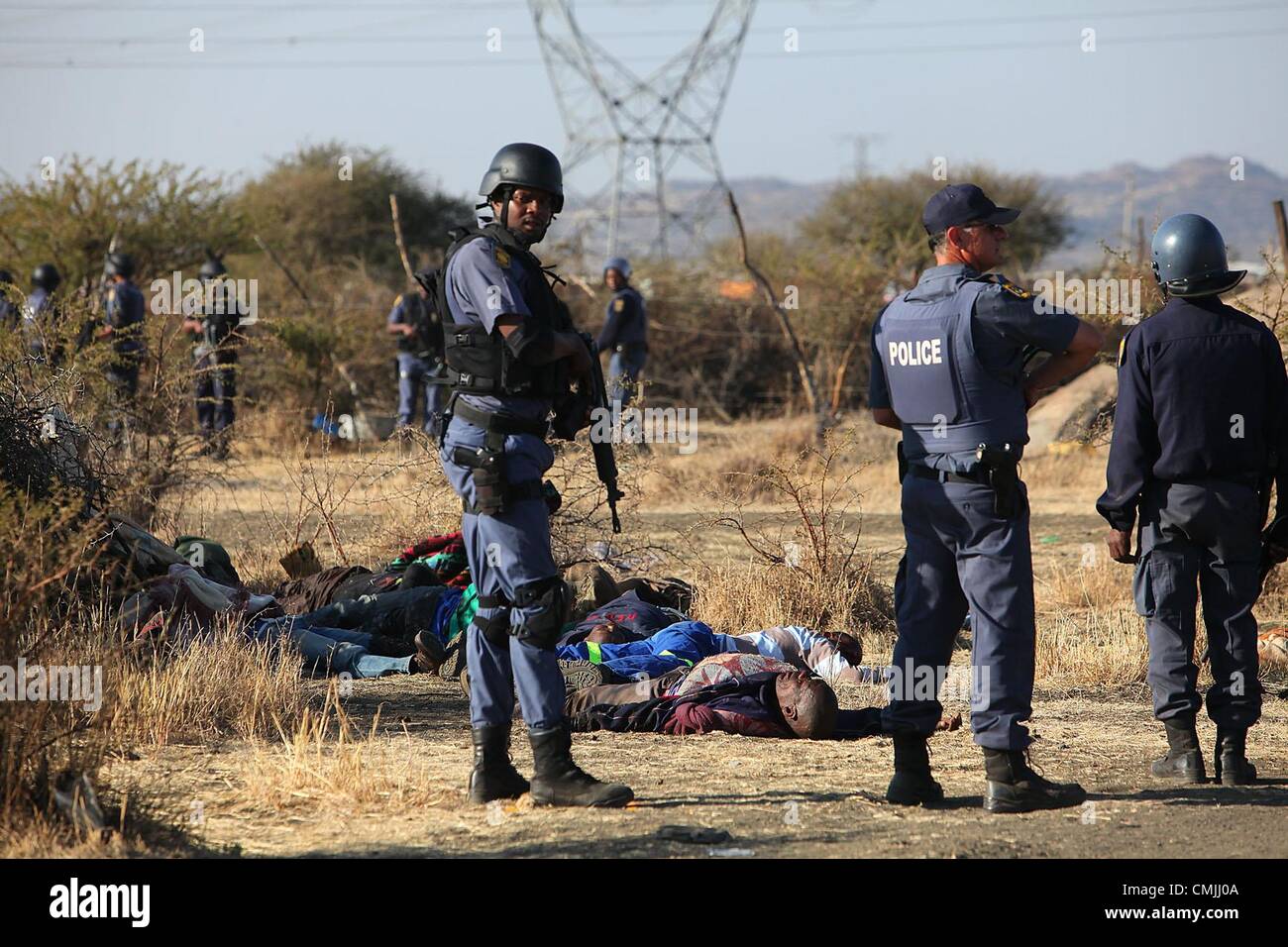16th Aug 2012. RUSTENBURG, SOUTH AFRICA: Police officers open fire on ...