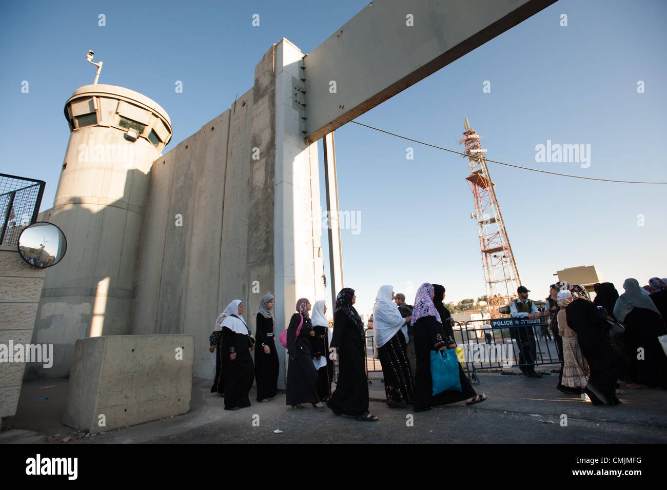 BETHLEHEM, WEST BANK - AUGUST 17, 2012: Palestinian women pass through ...