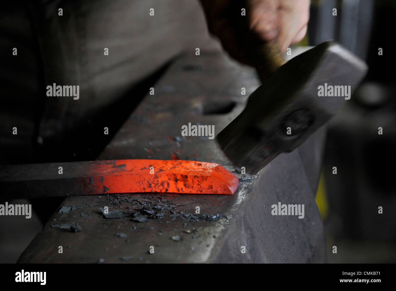 Three forgers from Pensylvania, USA work on big sundial during Forge ...