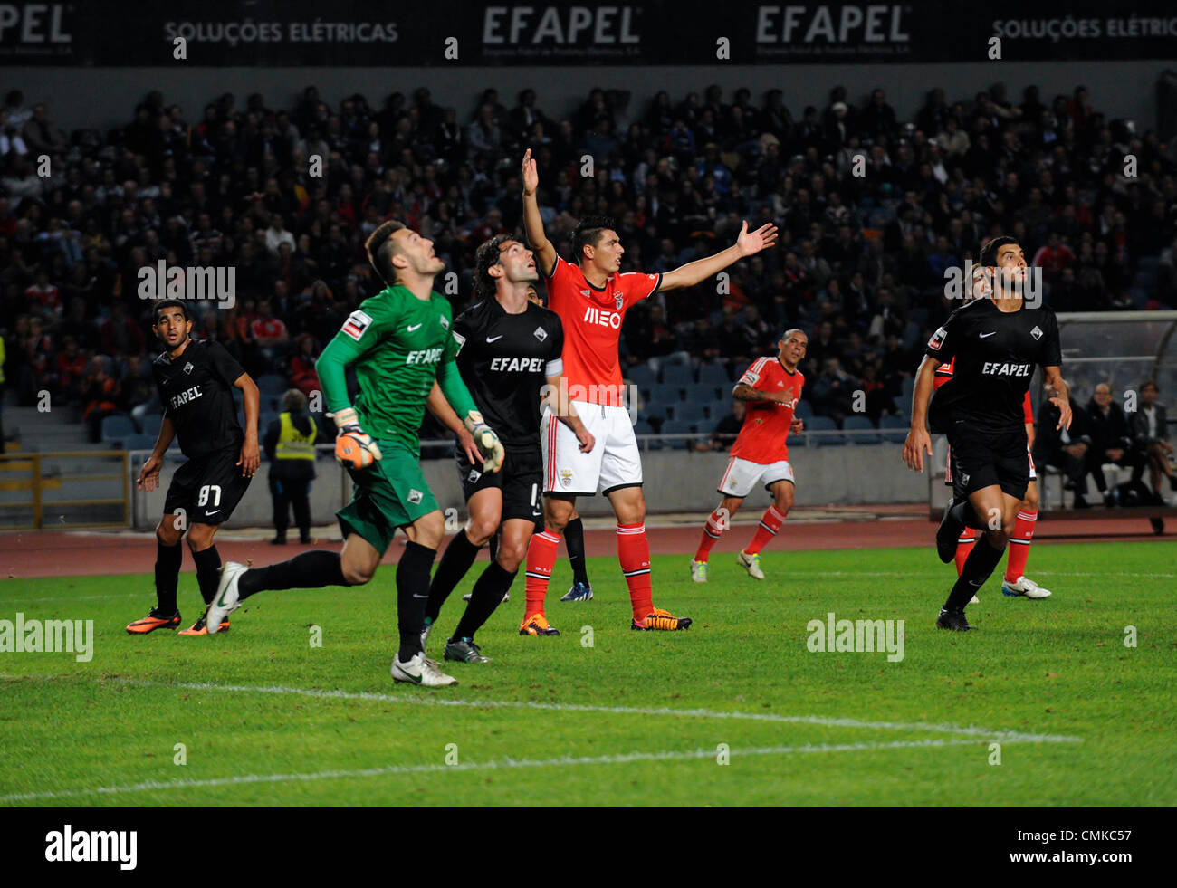 SL Benfica's Paraguayan striker Oscar Cardozo raises his arms to the ...