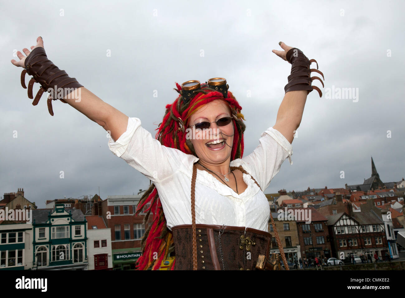 Whitby, Yorkshire, UK 2nd October, 2013. A happy woman arms up funny ...
