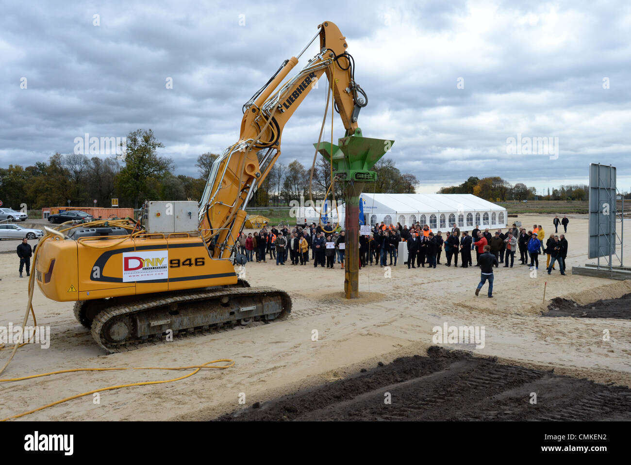 A construction vehichle makes the symbolic first dig for the new ...