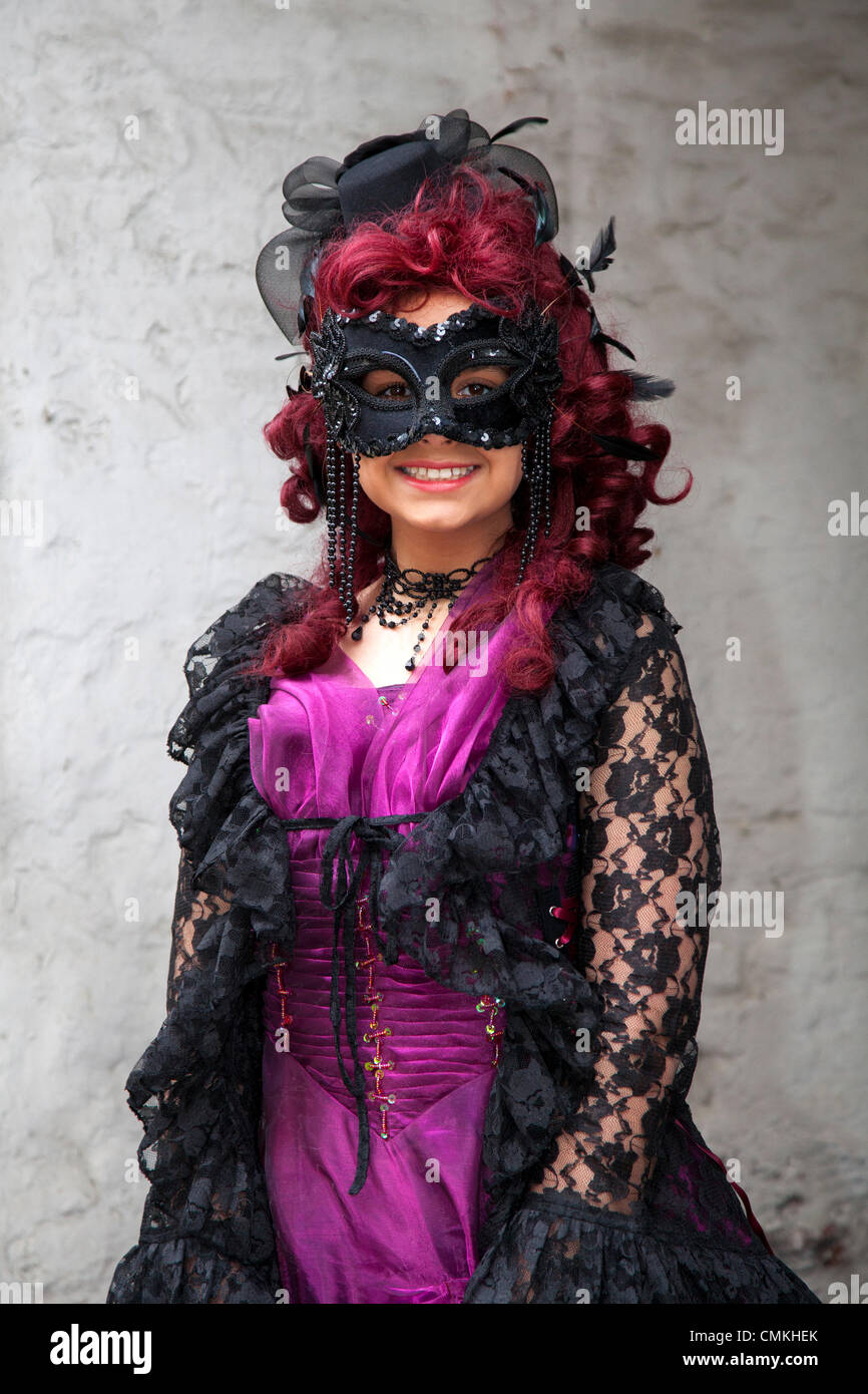 Woman. girl wearing purple goth costume with eye mask Whitby, Yorkshire ...