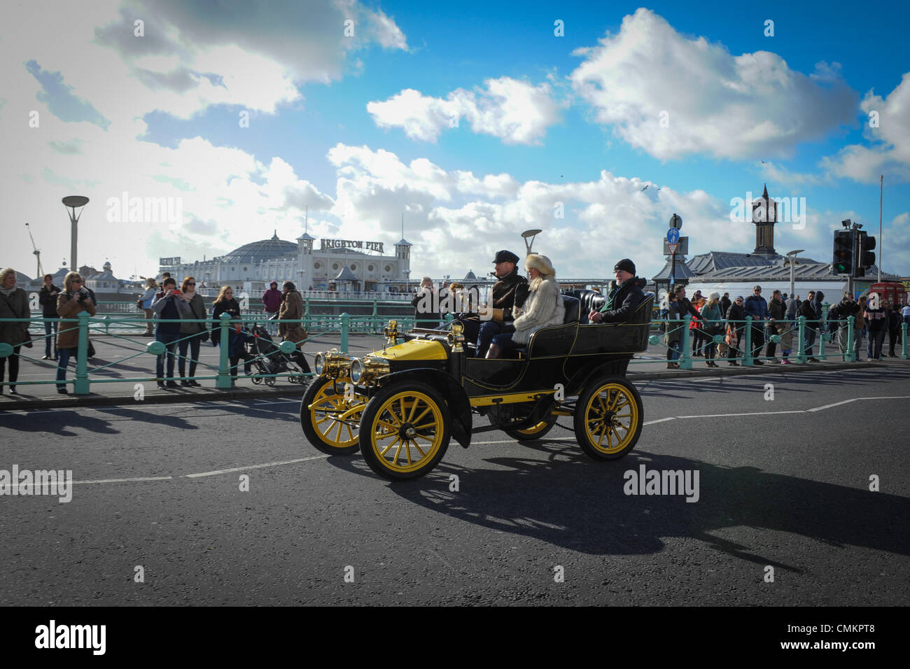 Competitors driving an old veteran open top car drive past the Brighton ...