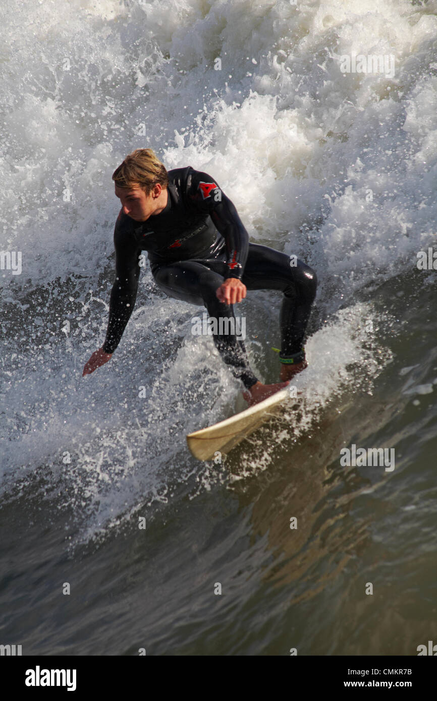 Bournemouth, Dorset UK. 3rd Nov, 2013. Surfers surfer making the most ...