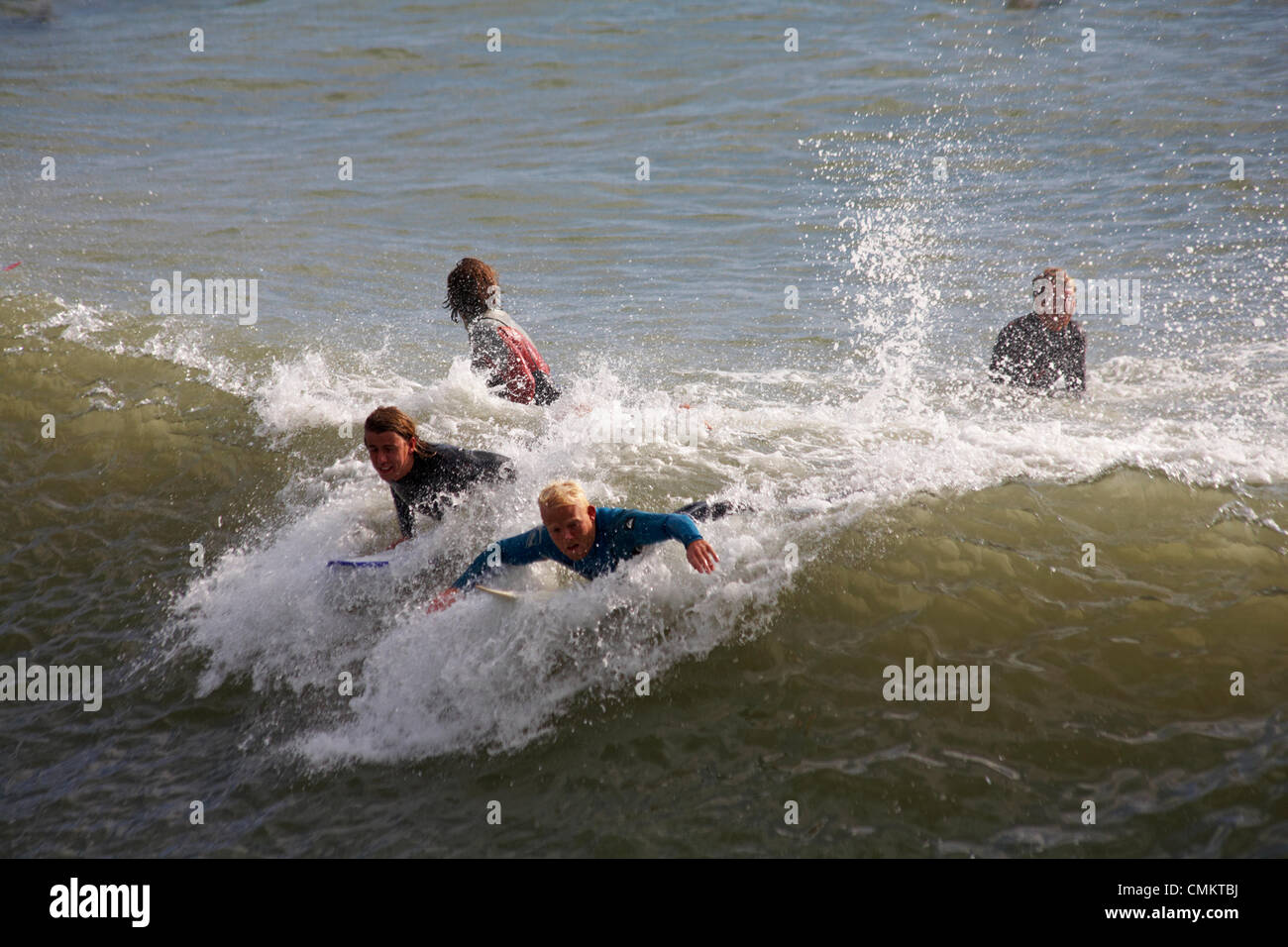 Bournemouth, Dorset UK. 3rd Nov, 2013. Surfers surfer making the most ...