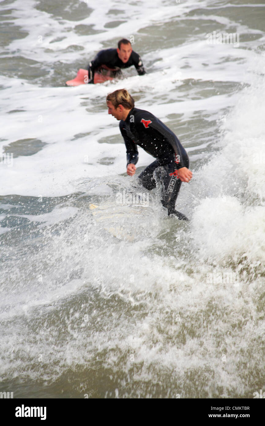 Bournemouth, Dorset UK. 3rd Nov, 2013. Surfers surfer making the most ...