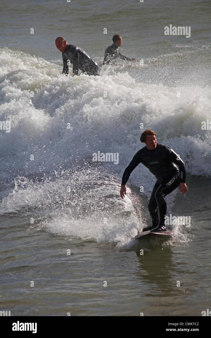 Bournemouth, Dorset UK. 3rd Nov, 2013. Surfers surfer making the most ...