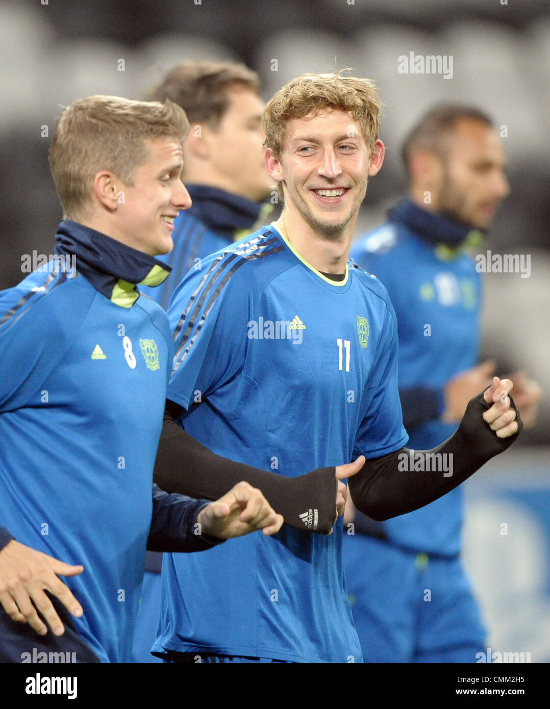 Donetsk, Ukraine. 04th Nov, 2013. Leverkusen's Lars Bender (L) and Stefan Kiessling jog during a ...