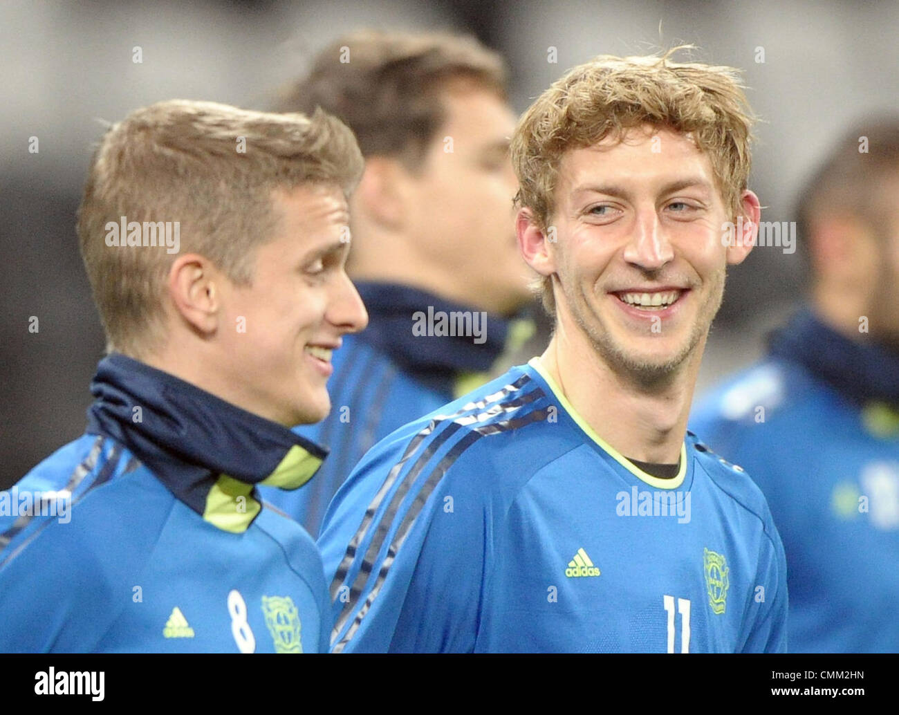 Donetsk, Ukraine. 04th Nov, 2013. Leverkusen's Lars Bender (L) and Stefan Kiessling jog during a ...