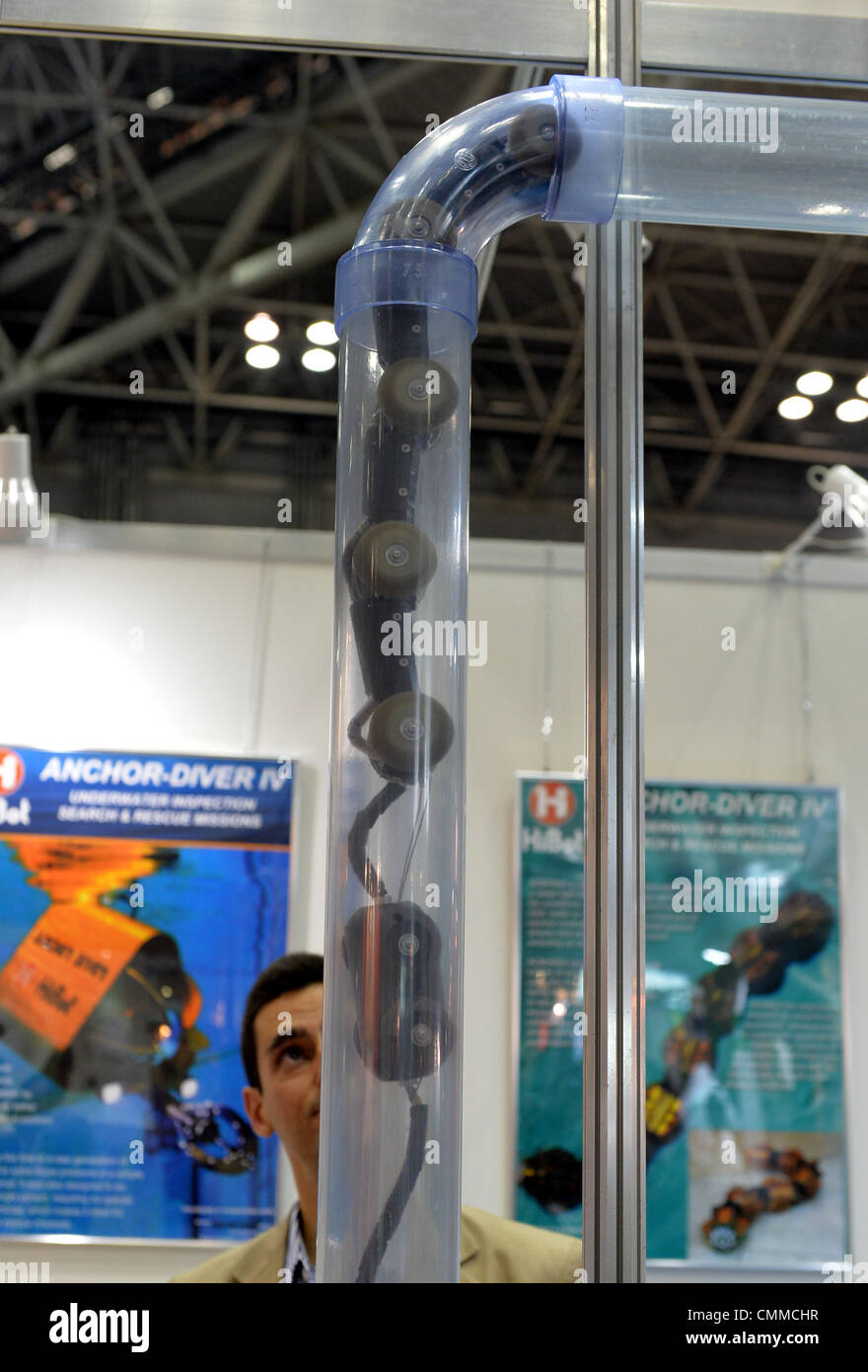 Tokyo, Japan. 6th Nov, 2013. A snake robot threads through the plastic ...