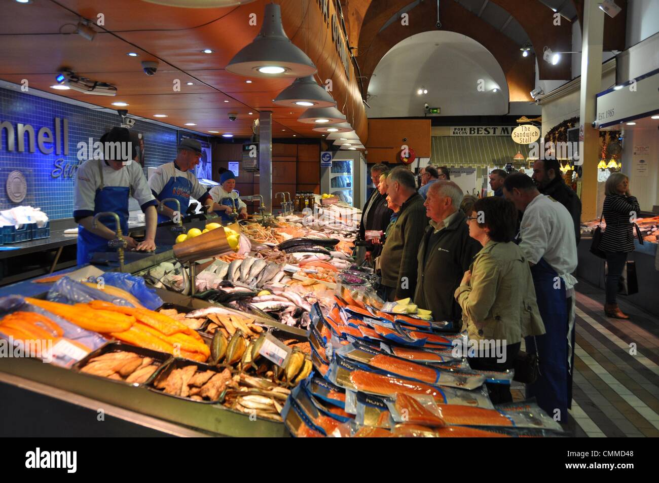 Clients look at fish and sea-food Visitors in the English Market in ...