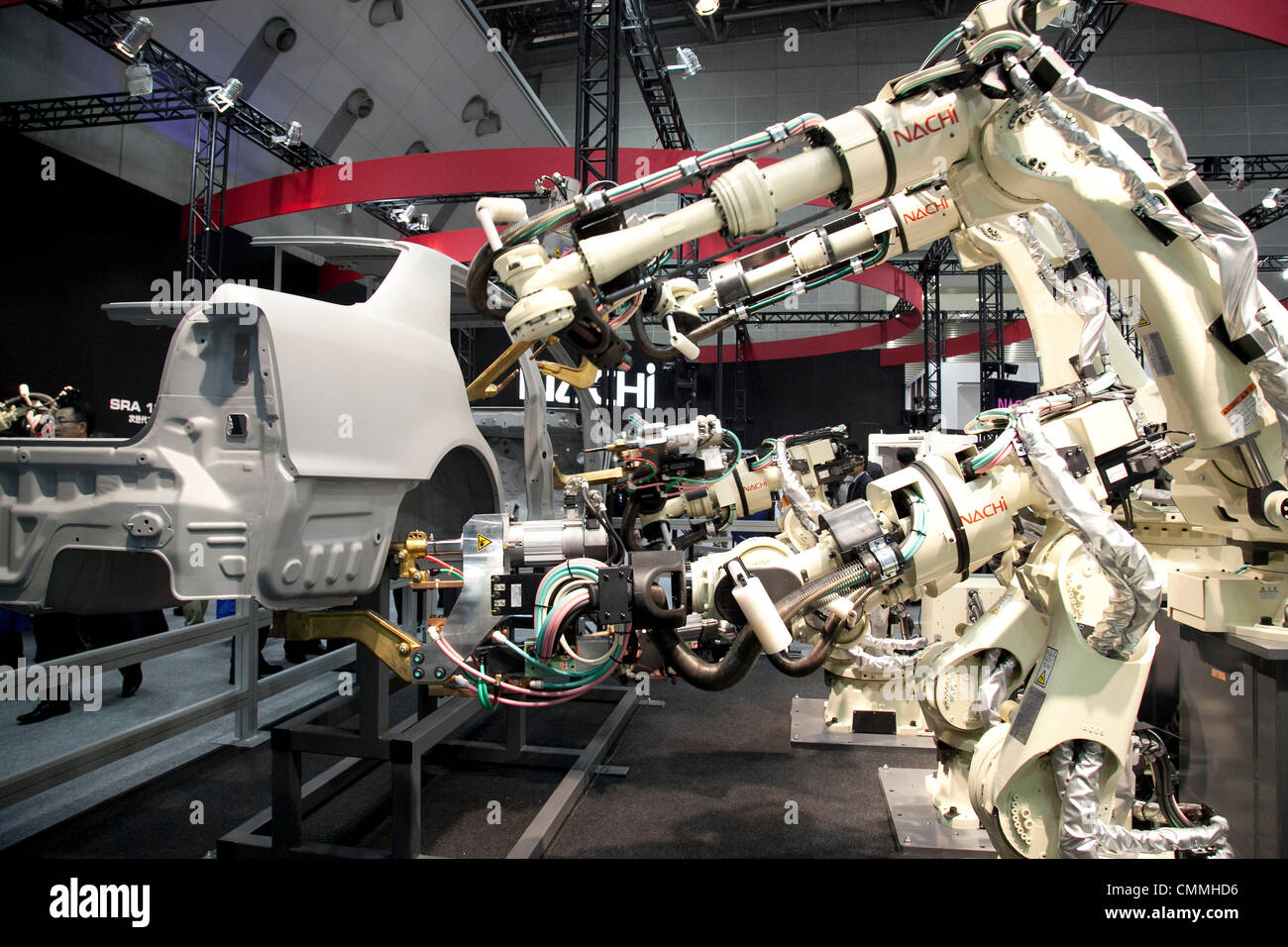 Tokyo, Japan. 6th Nov, 2013. The NACHI line up arm robots "SRA 100 J ...
