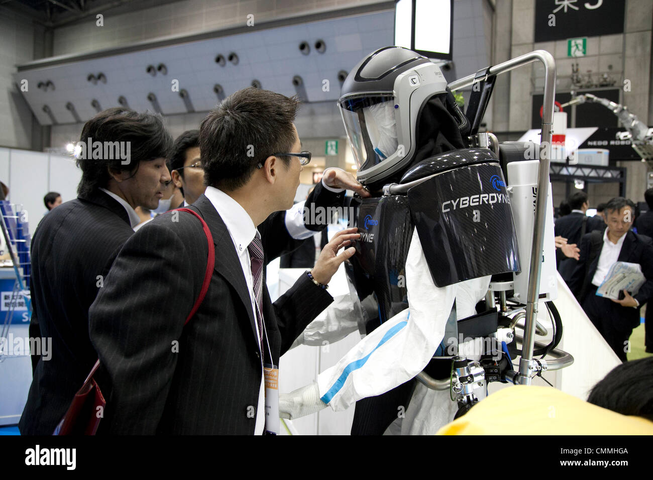 Tokyo, Japan. 6th Nov, 2013. Visitors see the robot suit of CYBERDINE ...