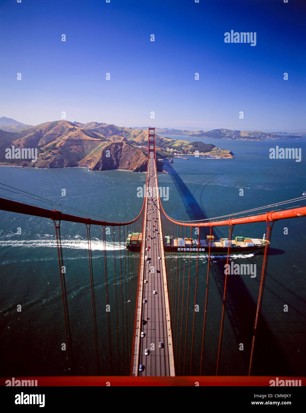 A container ship arrives from Asia, under the Golden Gate Bridge, San ...