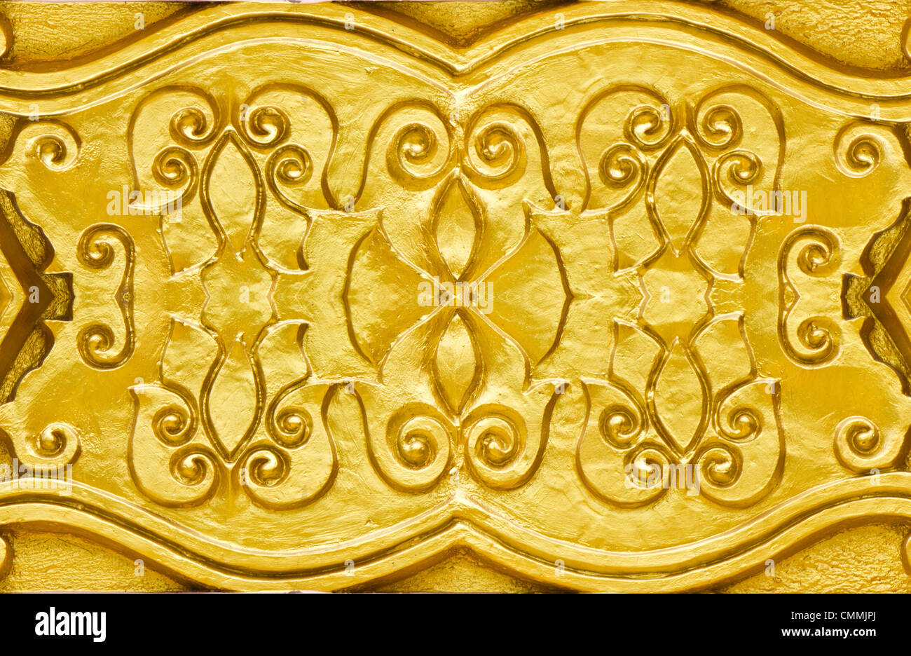 Native art carved on the wall in the temple Stock Photo - Alamy