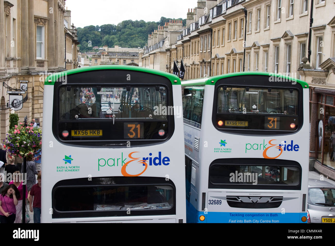 Park and Ride buses passing in Bath's busy main shopping street Stock ...