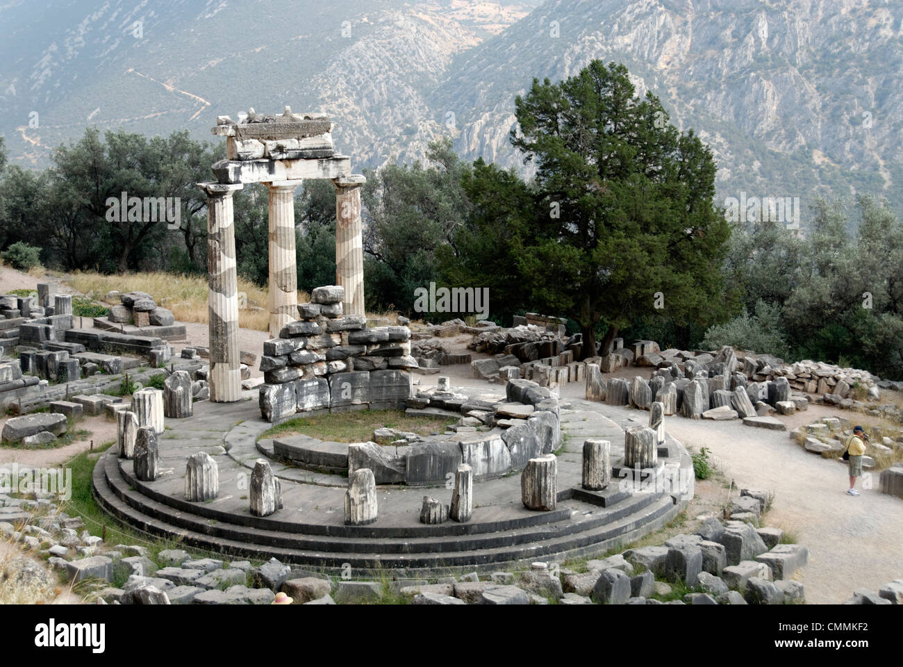 Delphi. Greece. View of the circular elegant Tholos with its three ...