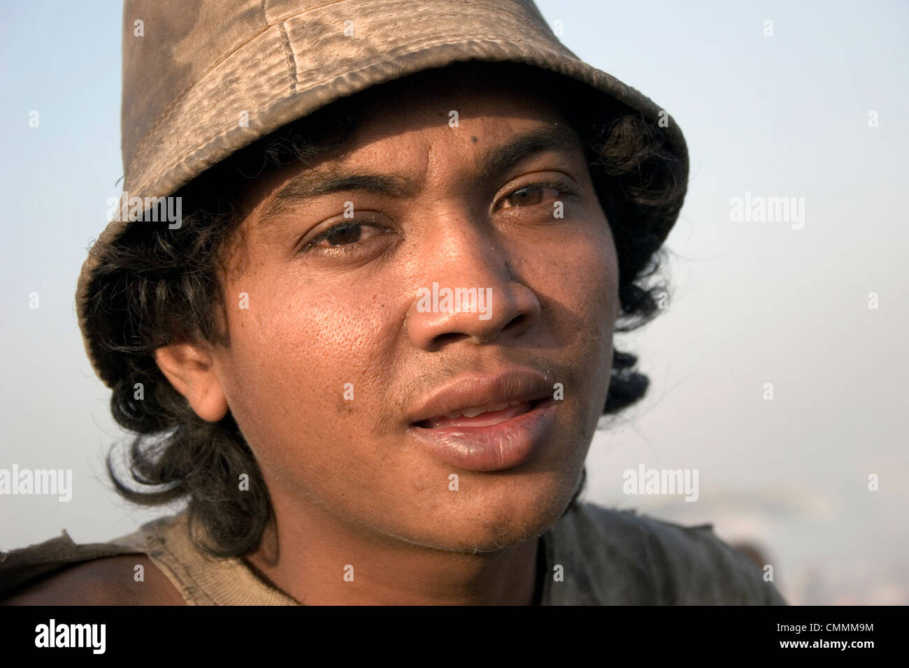 A young man who works as a scavenger is taking a rest at toxic Stung ...